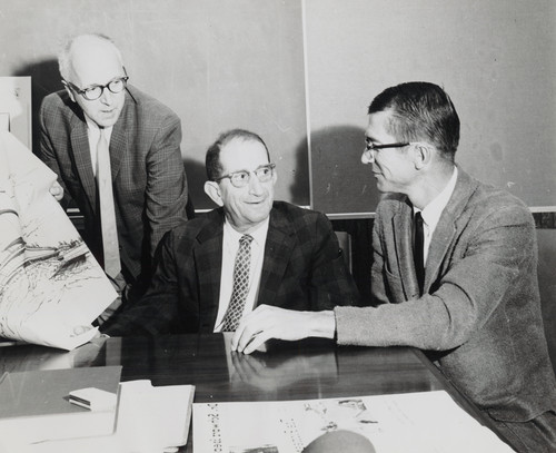 Ralph Shaw, Dale Wren, and Floyd Erickson looking at artist's ...
