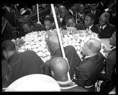 Pallbearers carrying casket at G.C. Coleman funeral service — Calisphere