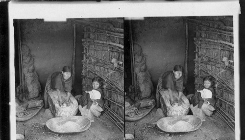 A country housewife grinding oats for bread, home on Ambato - Riobamba ...
