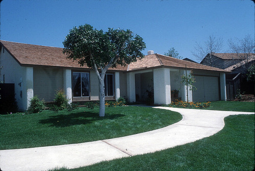 [New Castille Homes, plan 10 model home exterior slide] — Calisphere