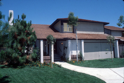 [New Castille Homes, plan 40 model home exterior slide] — Calisphere