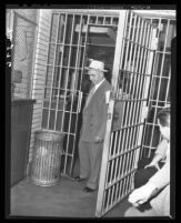 Tony Cornero, gambling ship operator entering jail cell, 1946 — Calisphere