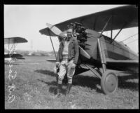 Art Goebel standing in front of his monoplane, probably at Mines Field ...