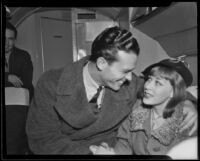 Actor Craig Reynolds and actress and singer Gertrude Niesen in aircraft ...