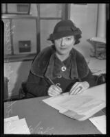 Dorothy Dunbar Wells signing documents, Los Angeles, 1936 — Calisphere