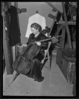 Cellist Elsa Hilger sits backstage with her cello, Los Angeles, 1936 — Calisphere