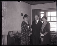 Dr. Bruce V. Black shaking hands with Ada D. Langston with his wife Mrs ...