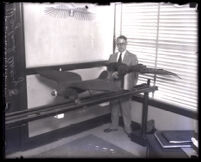 Wayland Avery compares J. H. Montgomery's model airplane designed like ...