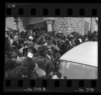Crowd encircling casket and hearse at funeral of singer Sam Cooke in ...