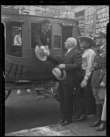 Governor Merriam and Buck Jones shake hands while Governor Allred ...
