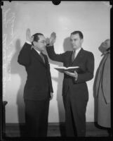 Judge Clarence L. Kincaid administering an oath to Judge Edward R ...