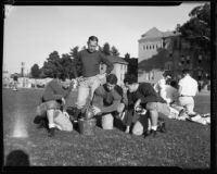 Football coach Howard Jones with player Cal Clemens and 2 others at USC ...