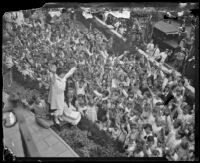 Aimee Semple McPherson with children during Angelus Temple services ...