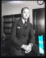 Jacob Berman seated at the edge of a desk in a law office, Los Angeles ...