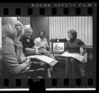 Great Expectations dating service founders with woman reviewing ...