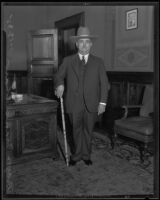 Mayor Frank Shaw posing with a stockman’s cane and a ten-gallon hat ...