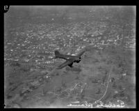 Art Goebel's monoplane, Yankee Doodle, in flight, circa 1928 — Calisphere