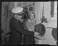 Officer C. C. Kinnett instructs Leah Howe about the engine order ...