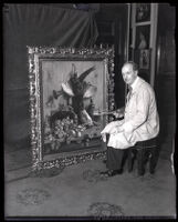 Artist and restorer Alver Regli sitting in front of a painting he's ...