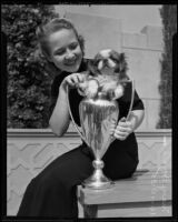 Mary Bovard with dog and trophy, Los Angeles, 1935 — Calisphere