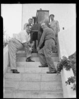 David L. Hutton, estranged husband of Aimee Semple McPherson, takes his piano from the Angelus ...