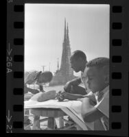 Against the background of the Watts Towers, art instructor Judson ...