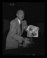 Attorney shows photographic evidence during the Monahan murder trial ...