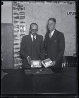 Undersheriff Frank Dewar and man holding a box, Los Angeles, 1930s ...