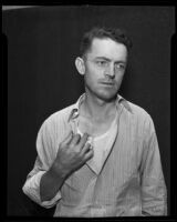 Charles B. Lynch, sculptor, charged with assault with a deadly weapon ...