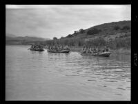 Thirty Marines row across a lake in 3 rafts during a training exercise ...