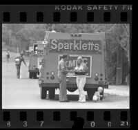 Sparkletts water delivery man signing up resident for free bottle water ...