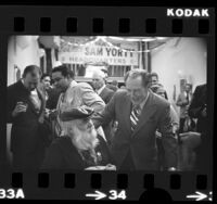 Los Angeles Mayor Sam Yorty talking with elderly supporter at his re ...