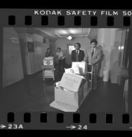 State Senator Alan Robbins and Reverend W. C. Jackson wheeling ...