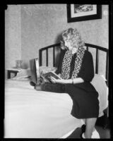 Helen Lee Worthing sits reading a book, California, 1933 — Calisphere