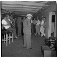 Tony Cornero surrounded by staff on his newly refurbished gambling ship ...