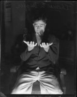 Thomas Edward Dugger, also known as "Ape Man", stares at hands while on ...