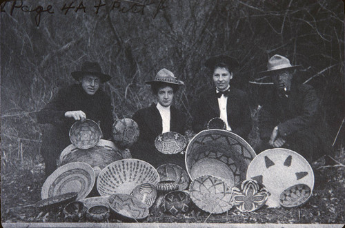 Four individuals with baskets purchased on the Morongo Indian ...