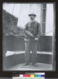 Full length portrait of William Letts Oliver on deck of boat ...
