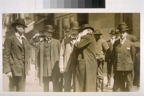 Henry Ach--one of Abe Ruef attys. in whispered conversation with Ruef ...
