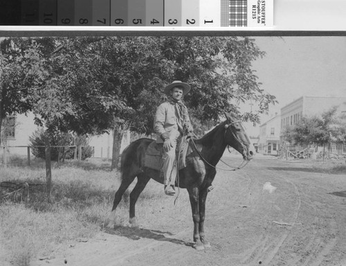 Photograph of "Curley" Johnson on his horse in Turlock, California ...