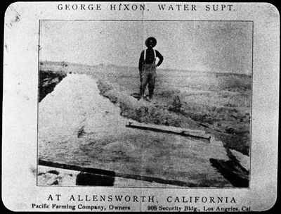 George Hixon Water Supt. standing on mound — Calisphere