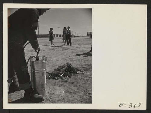 A demonstration of fire fighting with a stirrup pump is put on by an ...