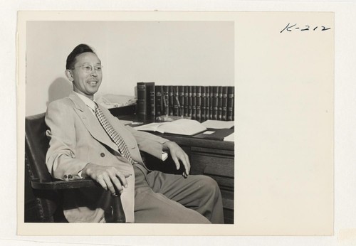 This picture shows Henry Taketa in his temporary office located at 5th ...