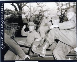 General J. Lawton Collins and party getting into a vehicle — Calisphere