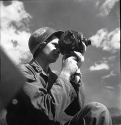 Soldier shooting a moving image camera — Calisphere