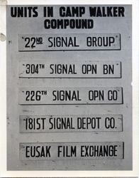 Sign listing military units in Camp Walker, Daegu — Calisphere
