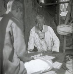 Two men playing janggi — Calisphere