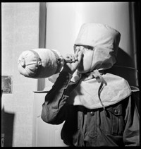 Fighting bomb fires. New mask for child — Calisphere