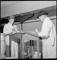 Valio Dairy. Taster [Men examining butter] — Calisphere