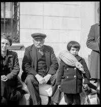 Features. Old man and child [Refugees. Givet, France?] — Calisphere